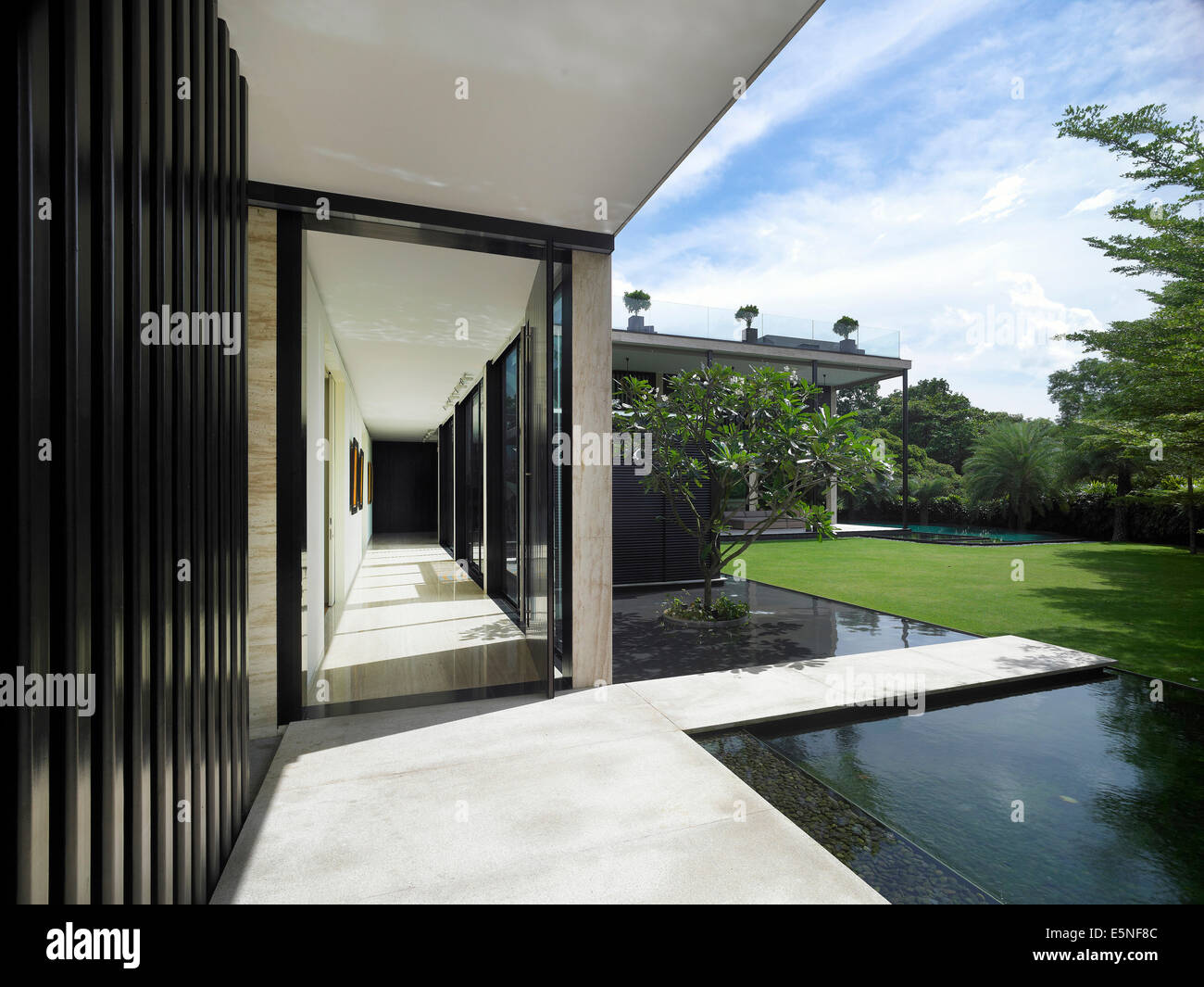 Water feature and tree, Private Residence, Singapore Stock Photo - Alamy