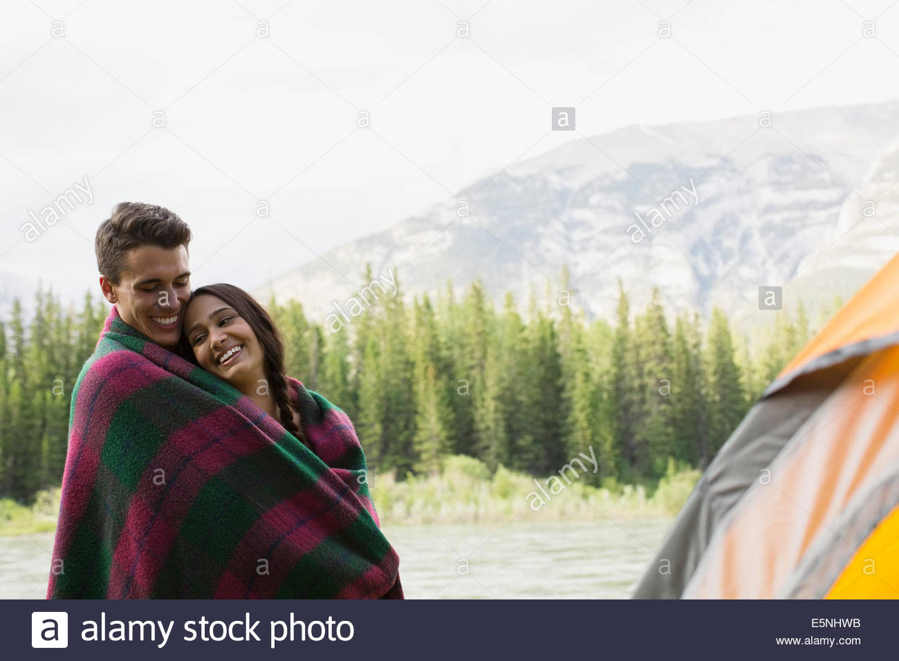 Woman cuddling blanket hi-res stock photography and images - Alamy