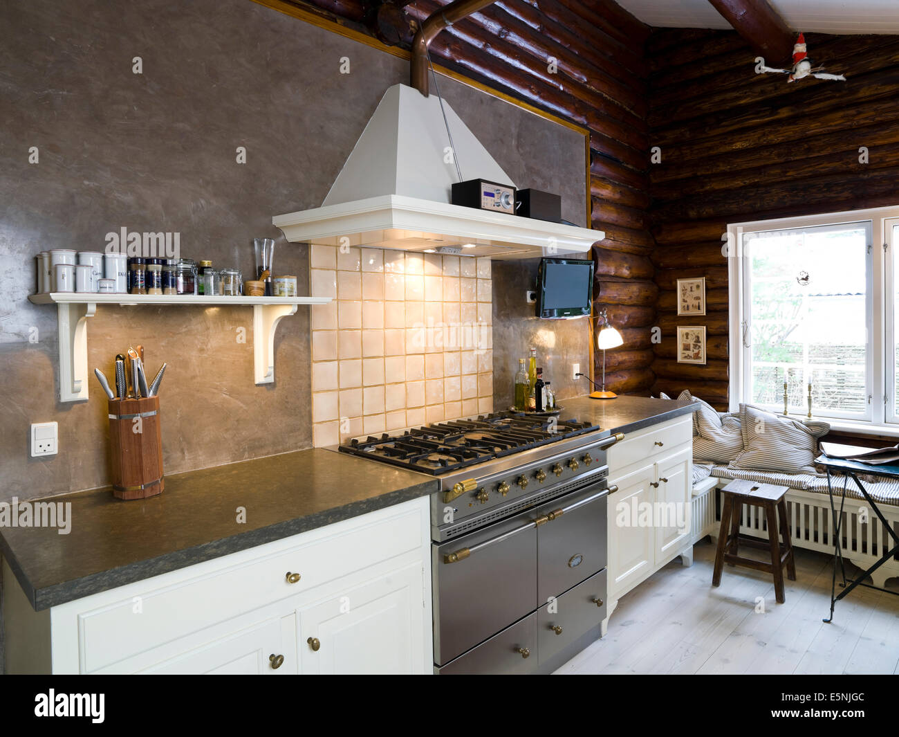 Kitchen with range oven in log cabin, Copenhagen, Denmark Stock Photo ...