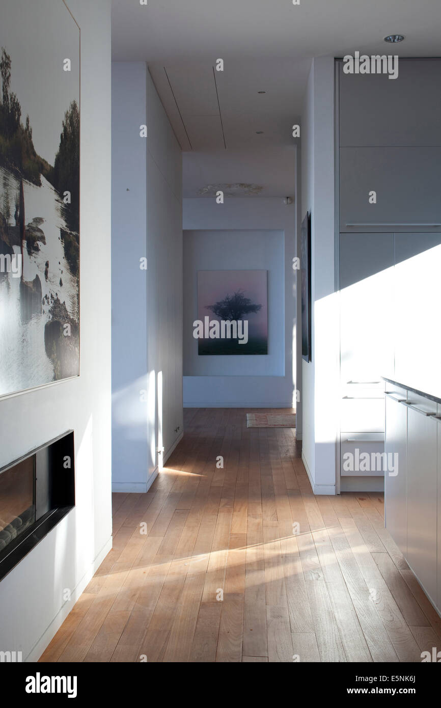 Open plan hallway detail with modern art in L House, Israel, Middle ...