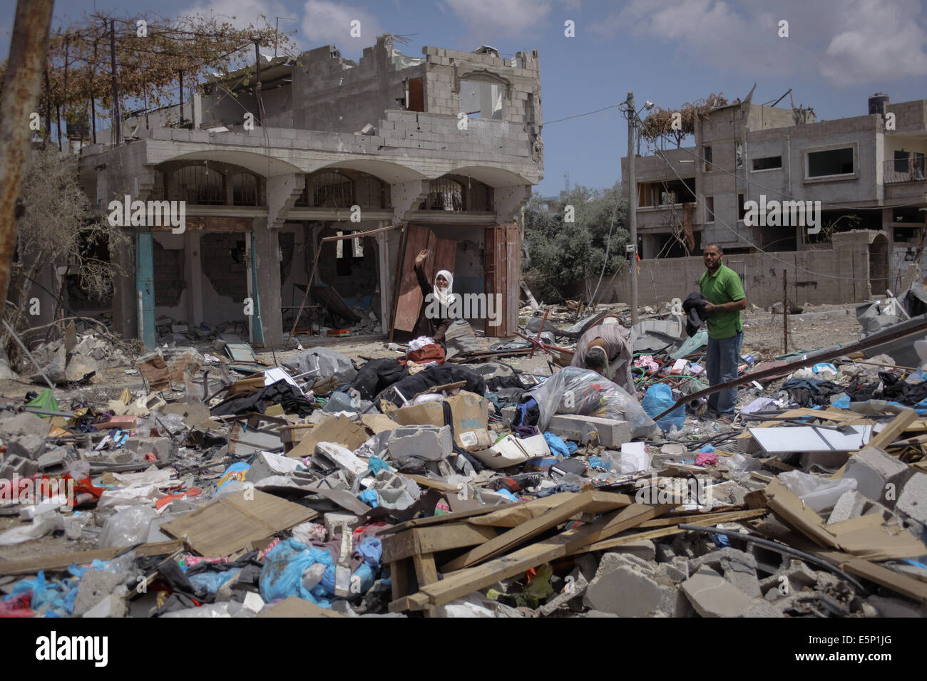 Gaza. 4th Aug, 2014. Palestinian inspects destroyed house in Beit ...