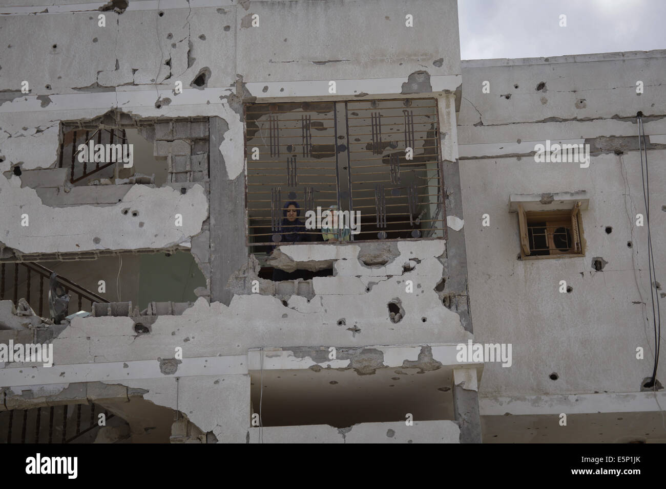 Gaza. 4th Aug, 2014. Women in the window of a destroyed house in Beit ...