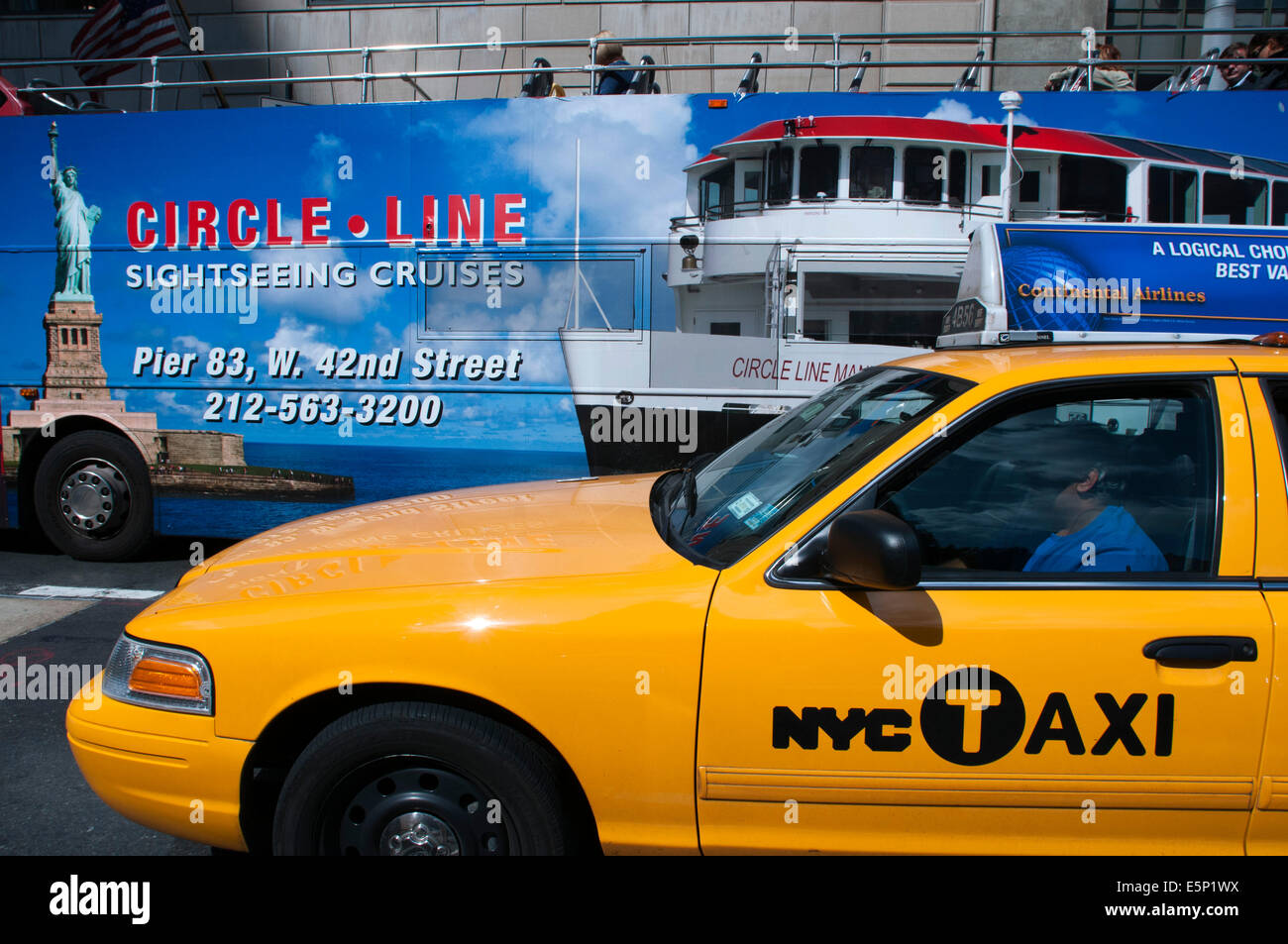 Yellow taxis in the area of Seaport and Civic Center. Tour bus with ...