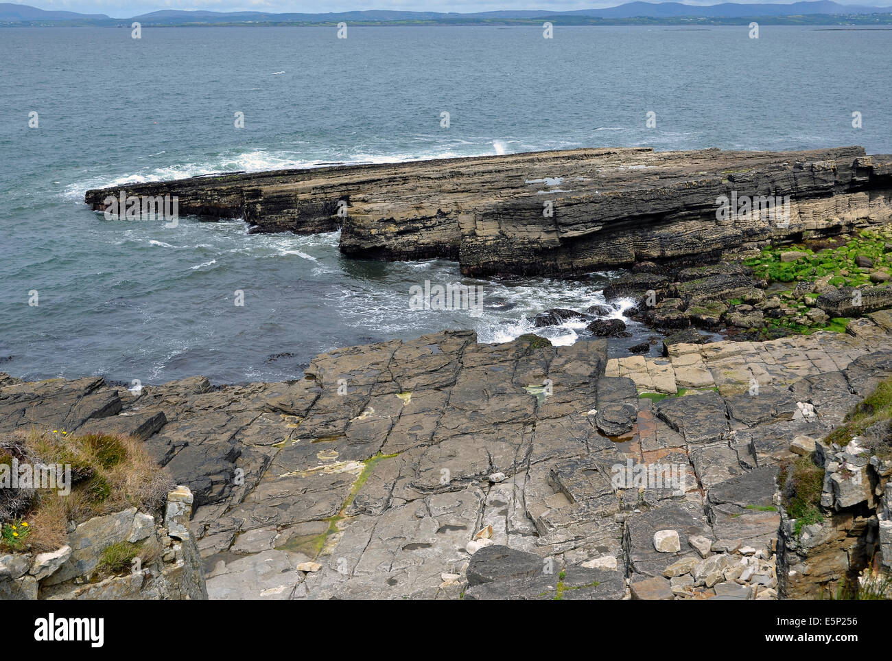 Coastal landscape with erosional features on Creevy Shore Walk coastal ...