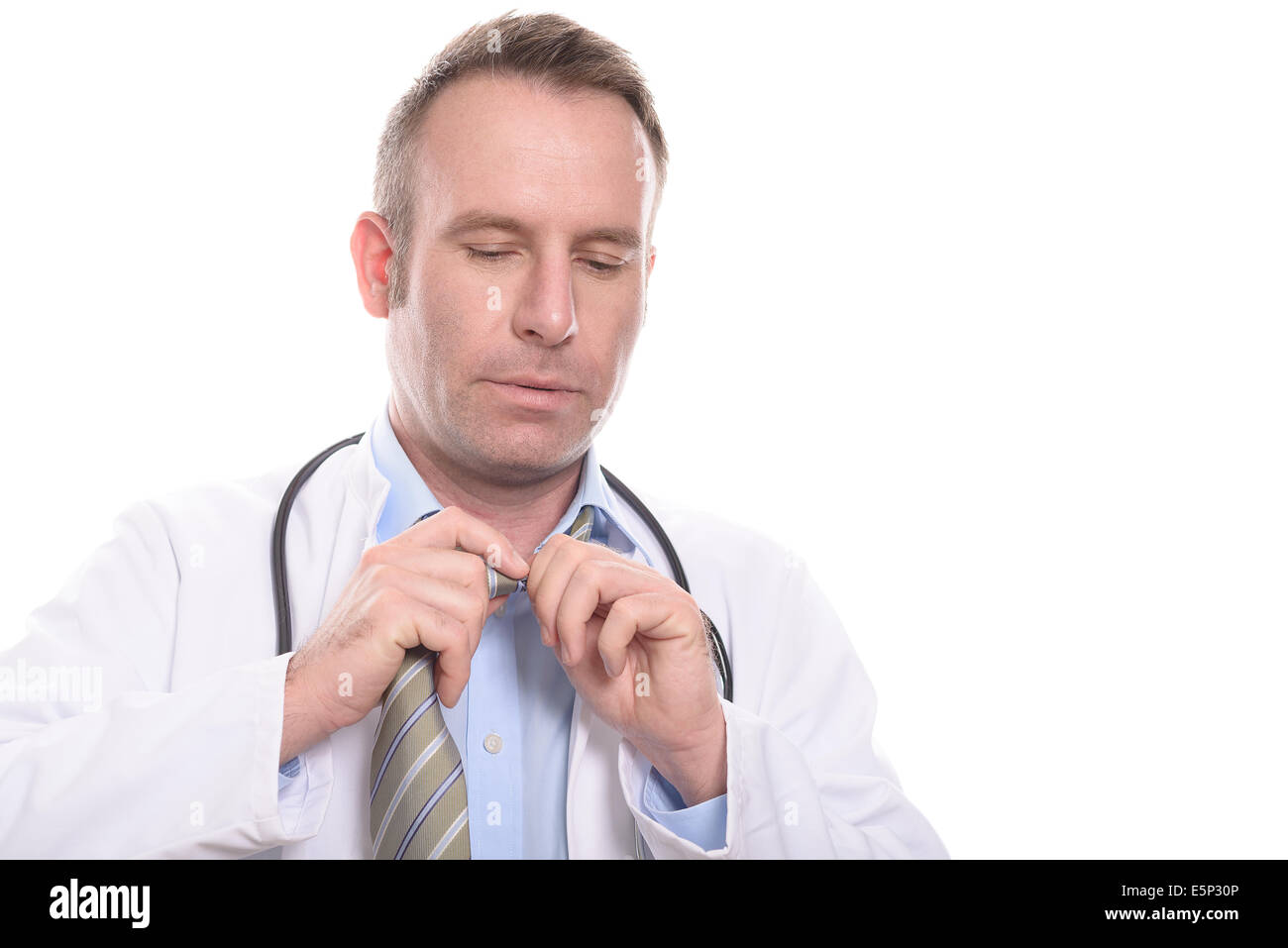 Tired and depressed middle-aged male doctor loosening his tie as he ...