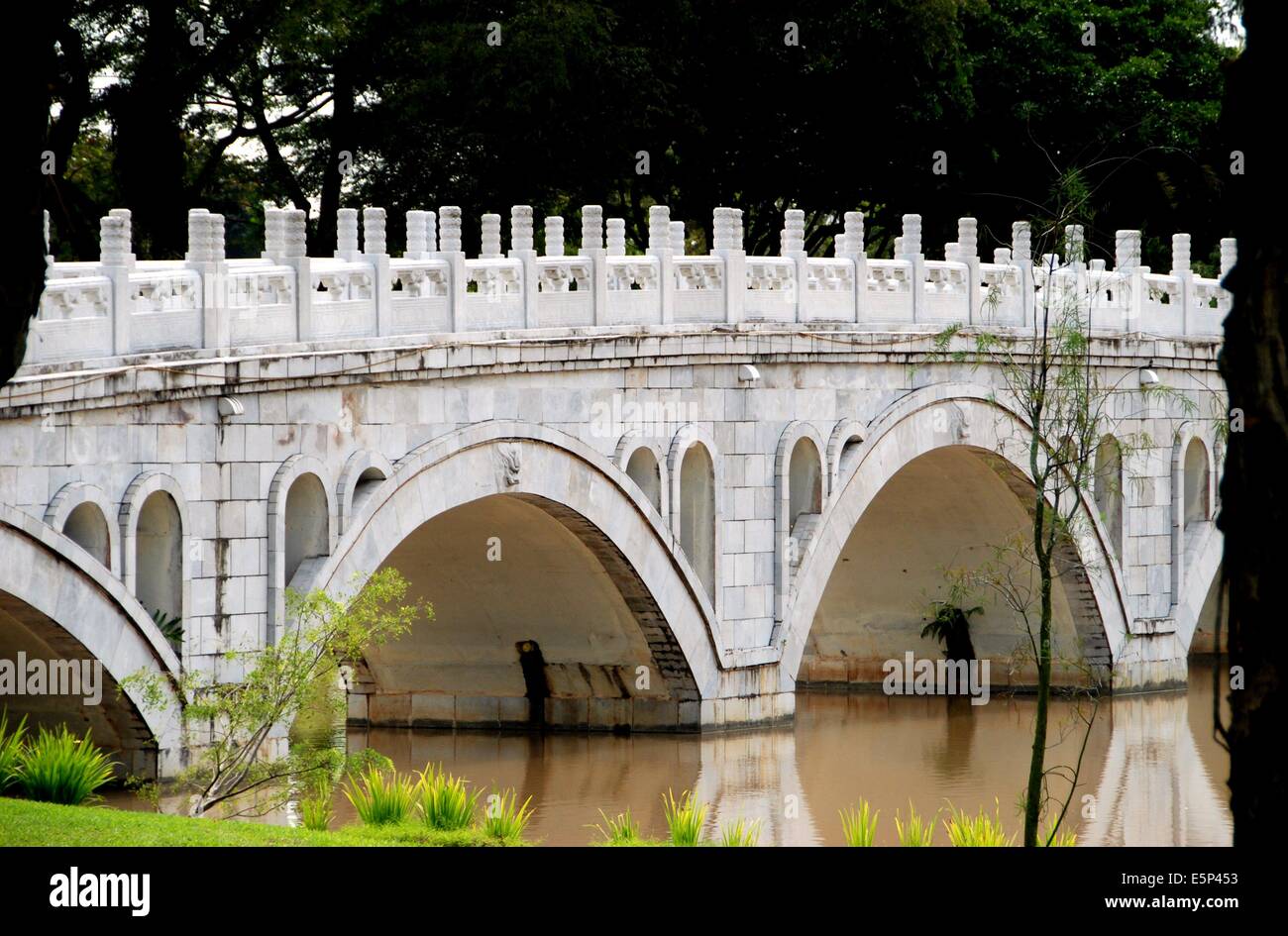 SINGAPORE: A graceful marble bridge spans the lagoon connecting the ...