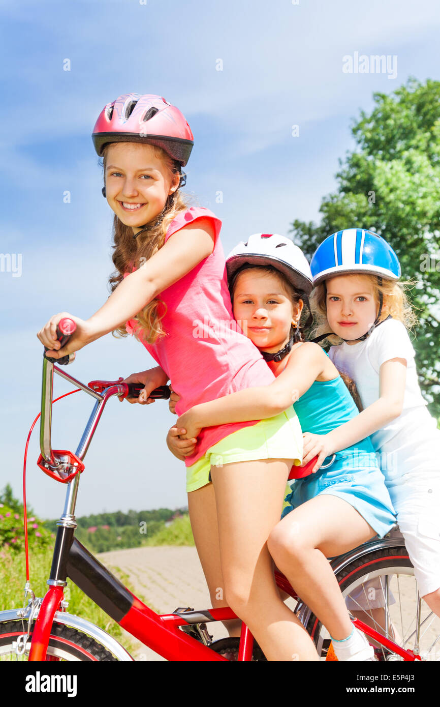 3 girls ride bike hi-res stock photography and images - Alamy