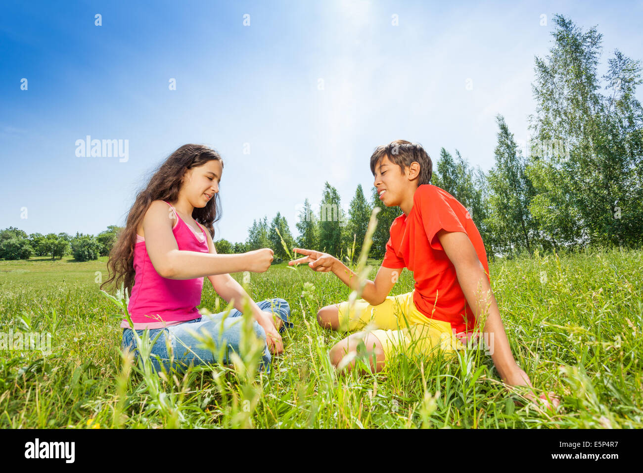 Kid hands rock paper scissors hi-res stock photography and images - Alamy
