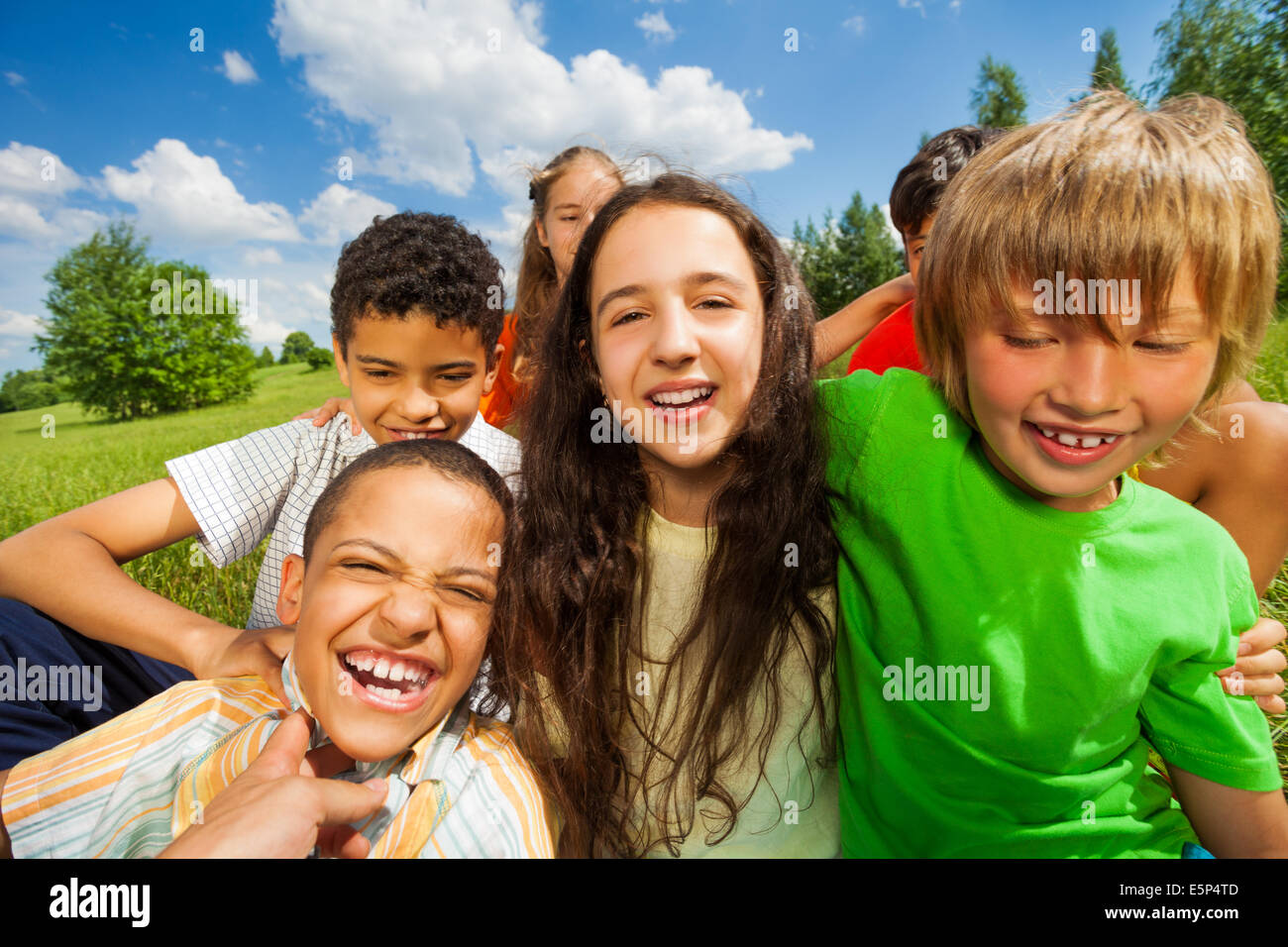 Kids group hug hi-res stock photography and images - Alamy