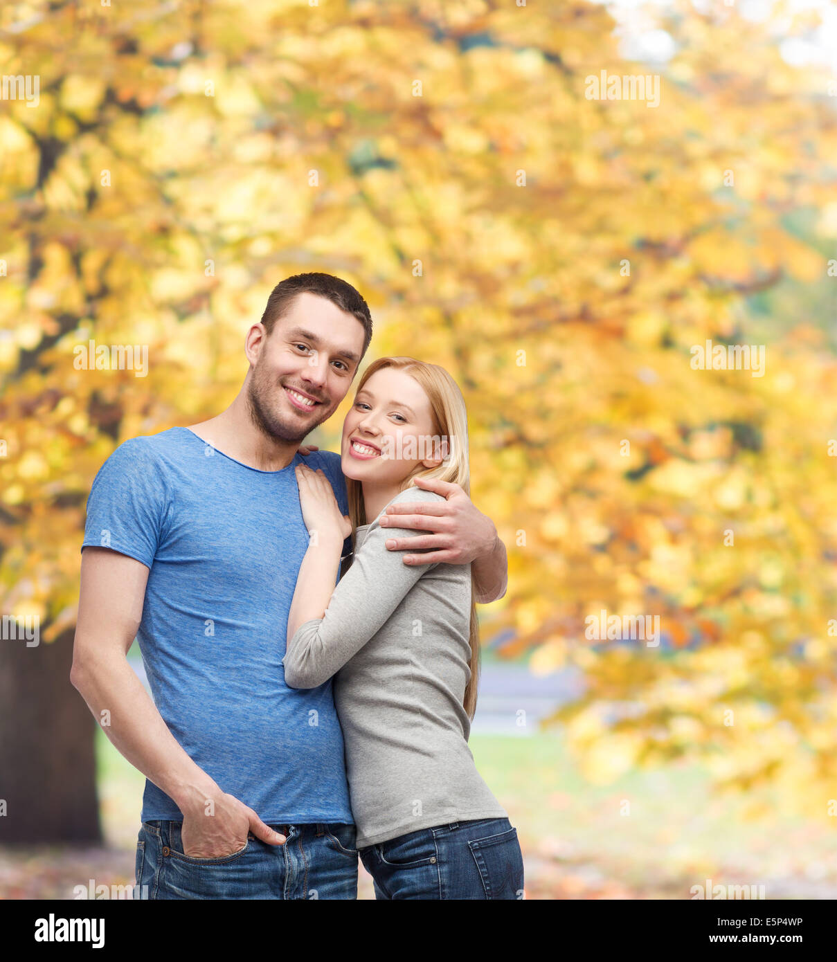 smiling couple hugging Stock Photo - Alamy