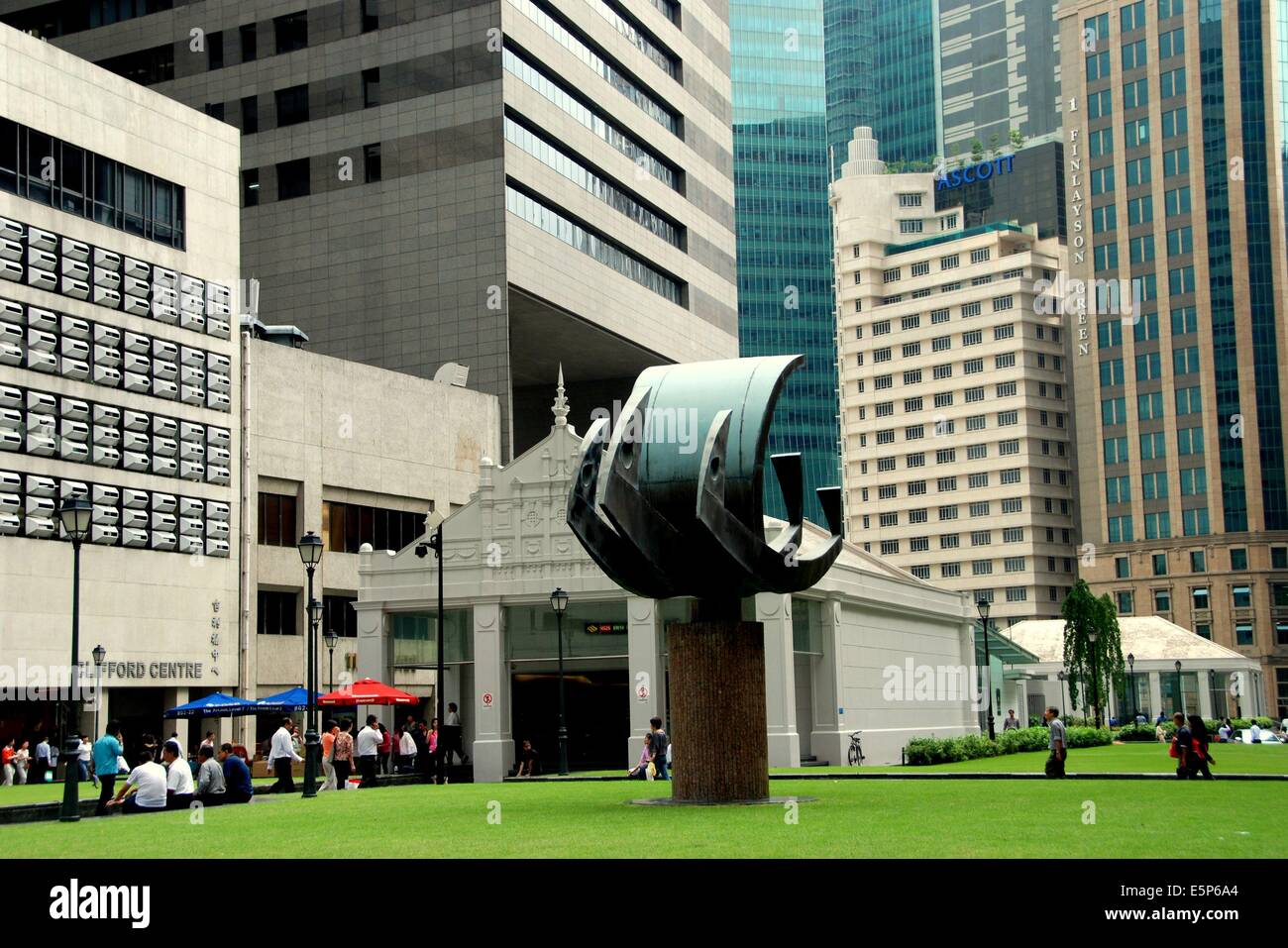 SINGAPORE: View of the green, MRT subway entrance, and a ship sculpture ...