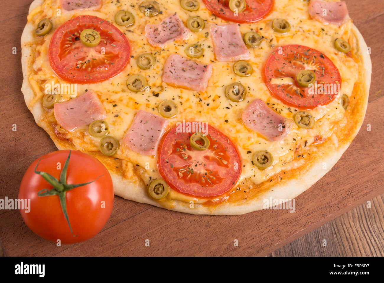 tomato pizza with ham and cheese Stock Photo - Alamy