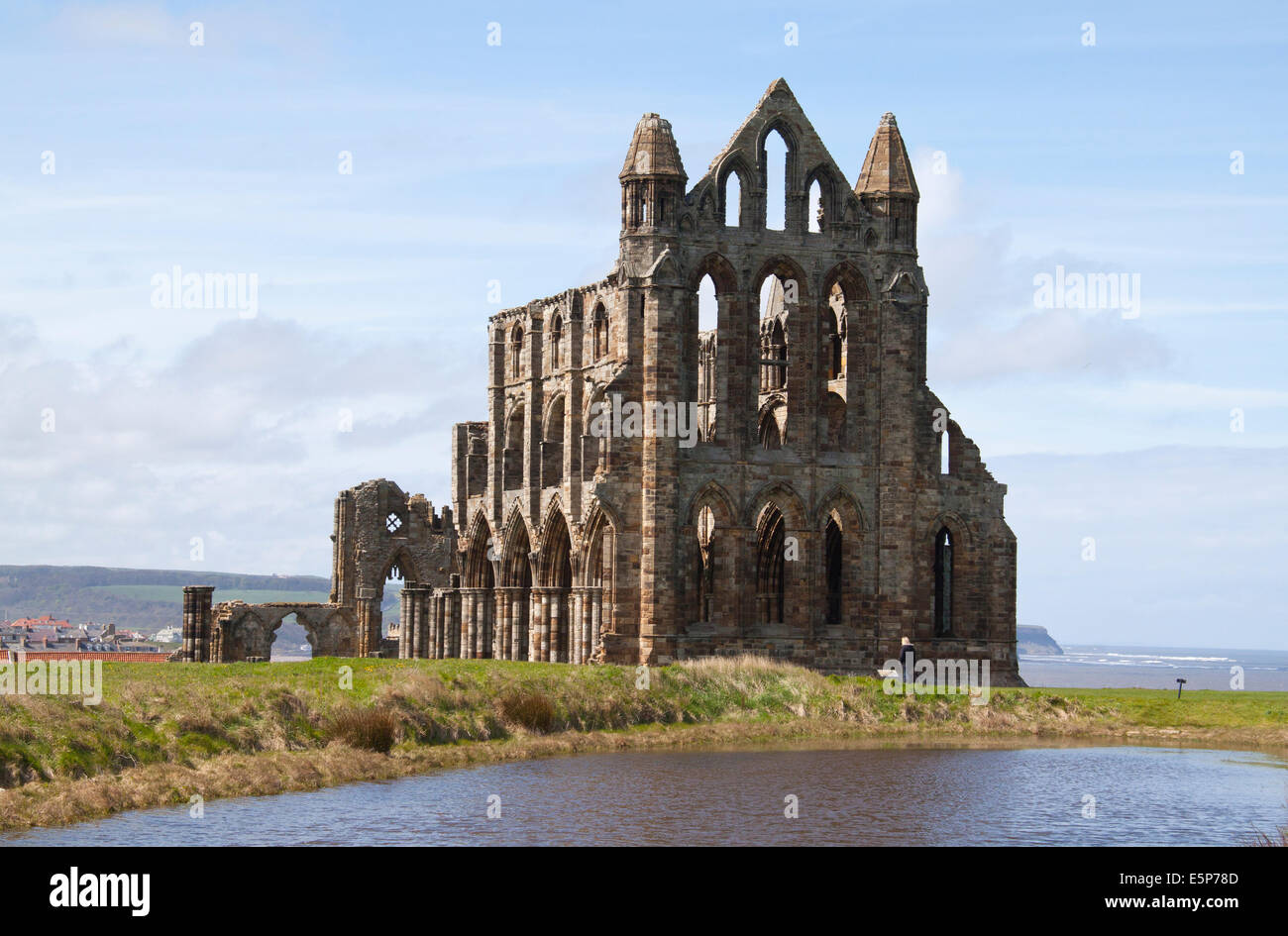 View of Whitby Abbey with a blue sky, showing the effect of weathering ...