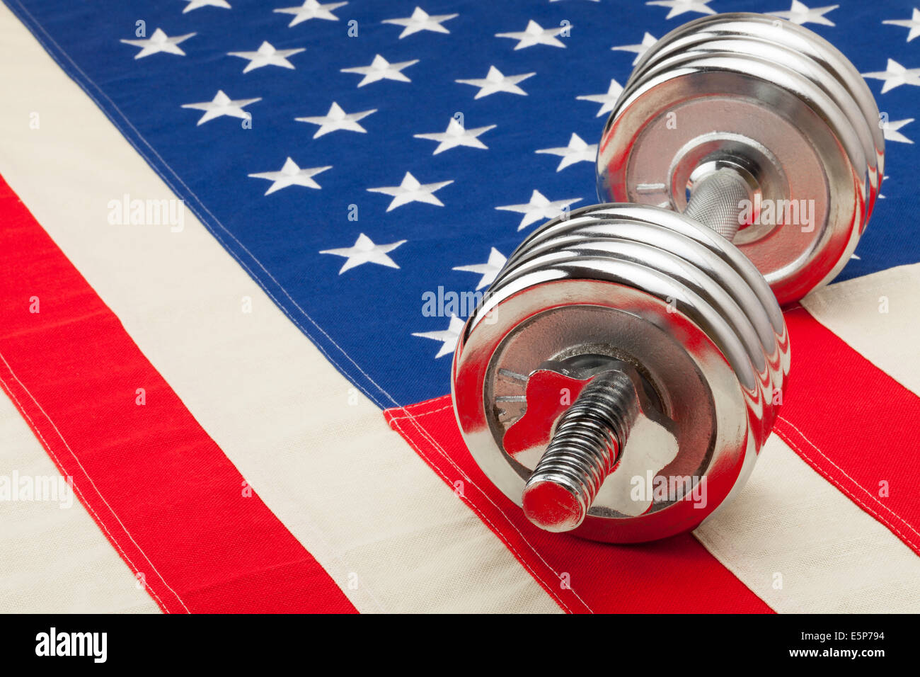 Metal dumbbells over USA flag as symbol of healthy nation Stock Photo ...