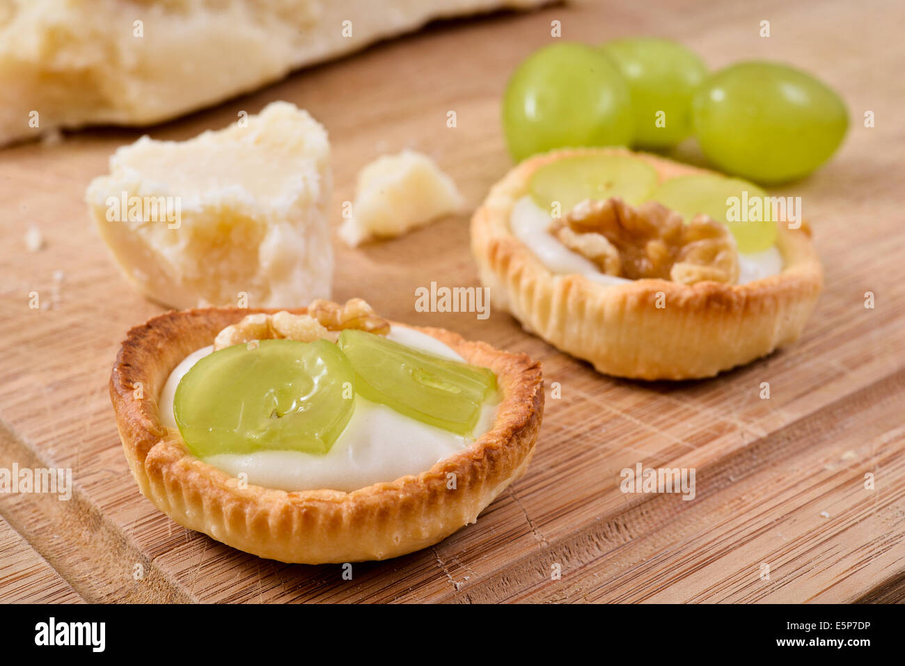 Italian appetizer. Baskets with parmesan cream, decorated with white ...