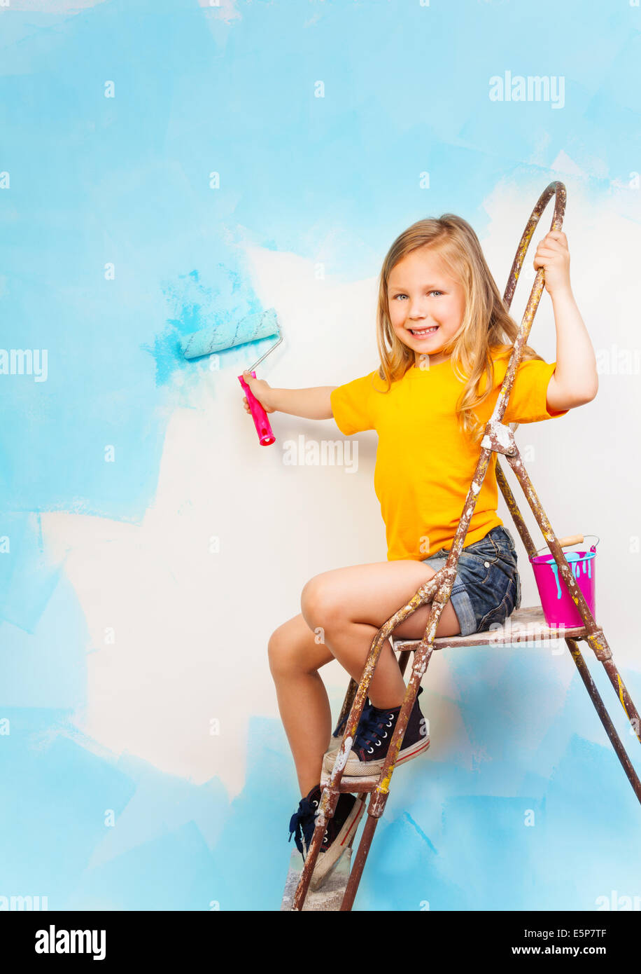 Little girl sits on a metal ladder Stock Photo - Alamy