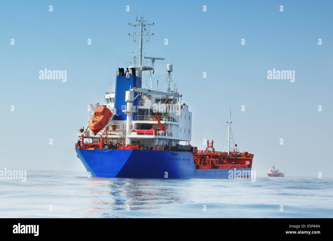 Tanker blue loaded back view in the ocean Stock Photo - Alamy