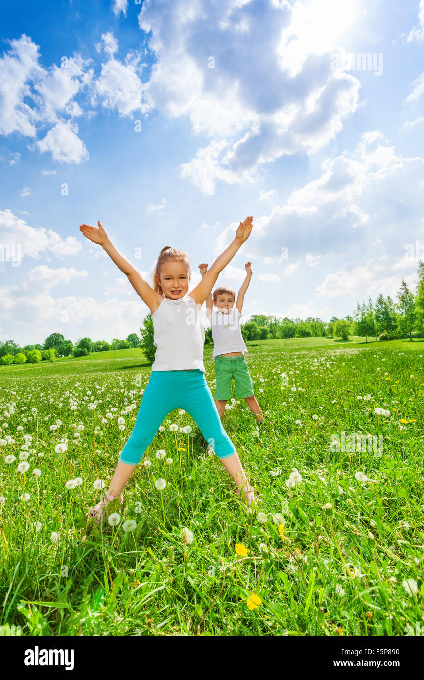 Two children doing gymnastics Stock Photo - Alamy