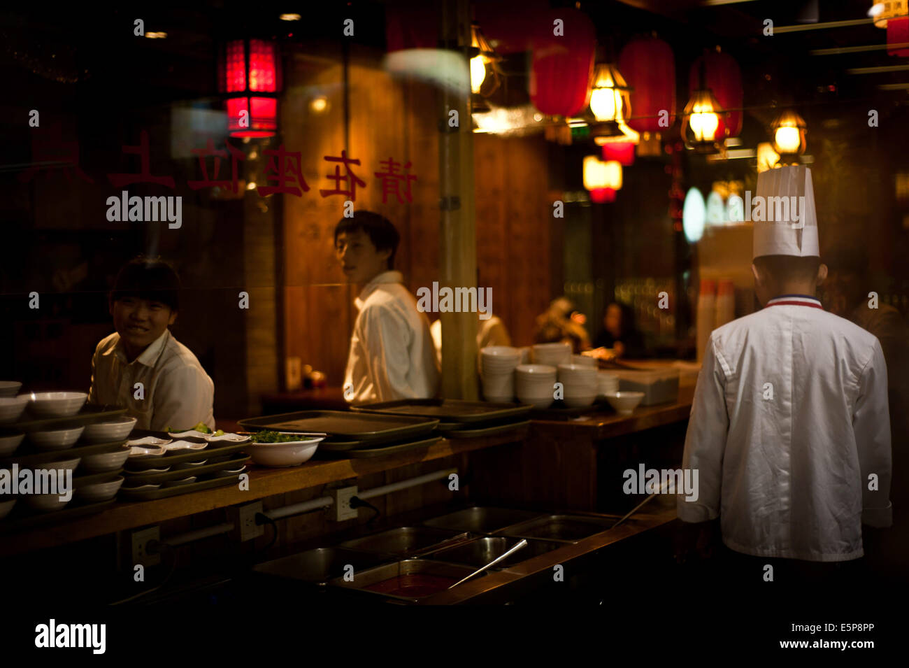 Waiters and the chef in a restaurant in Qianmen, Beijing, China at ...