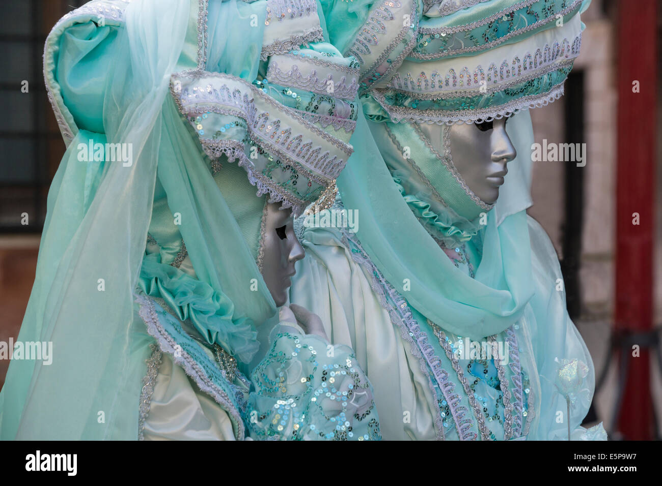 Pair of women in elaborate pale green costumes in San Zaccaria Square ...