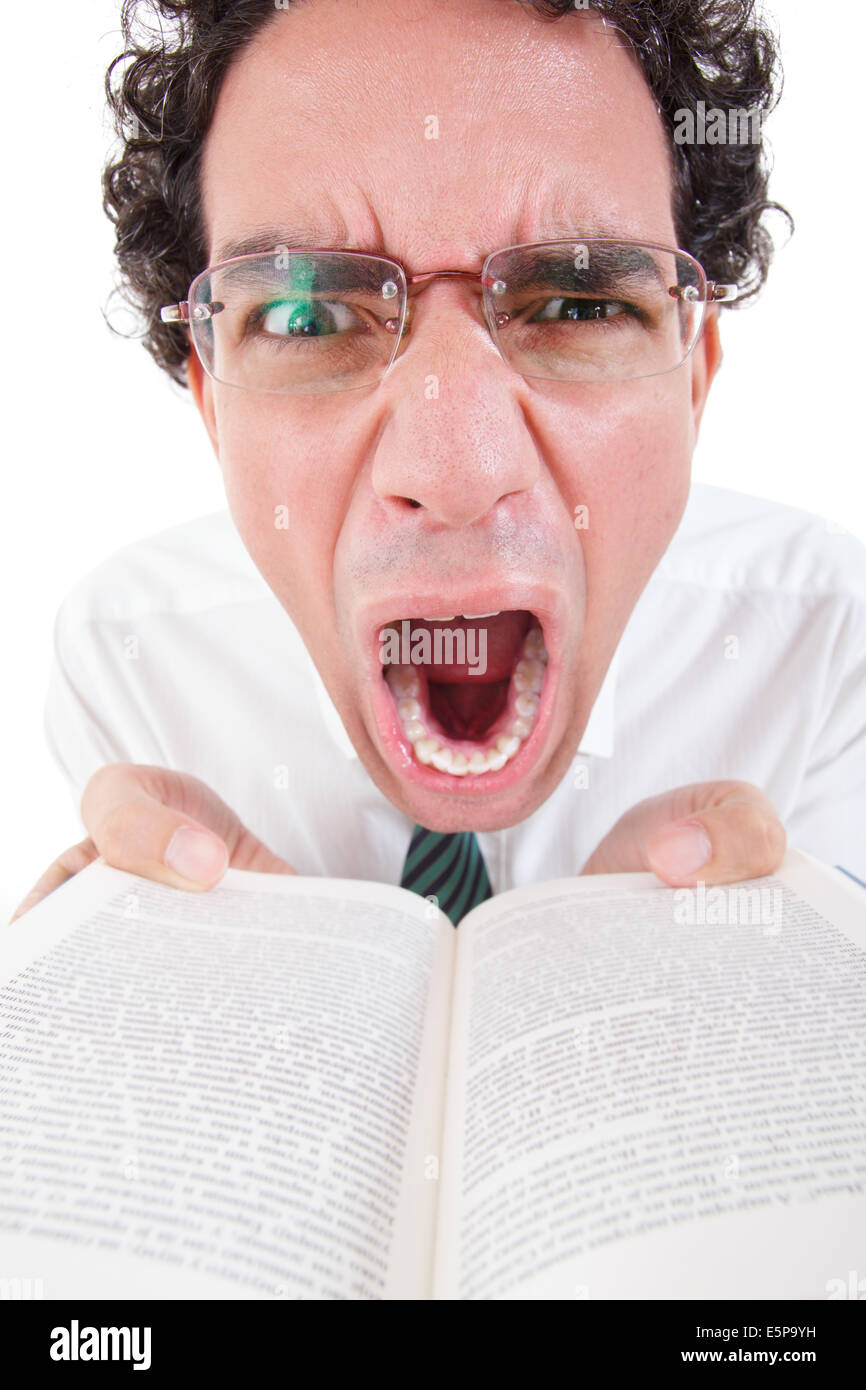 close up of angry nerd in shirt and tie with glasses holding open book ...