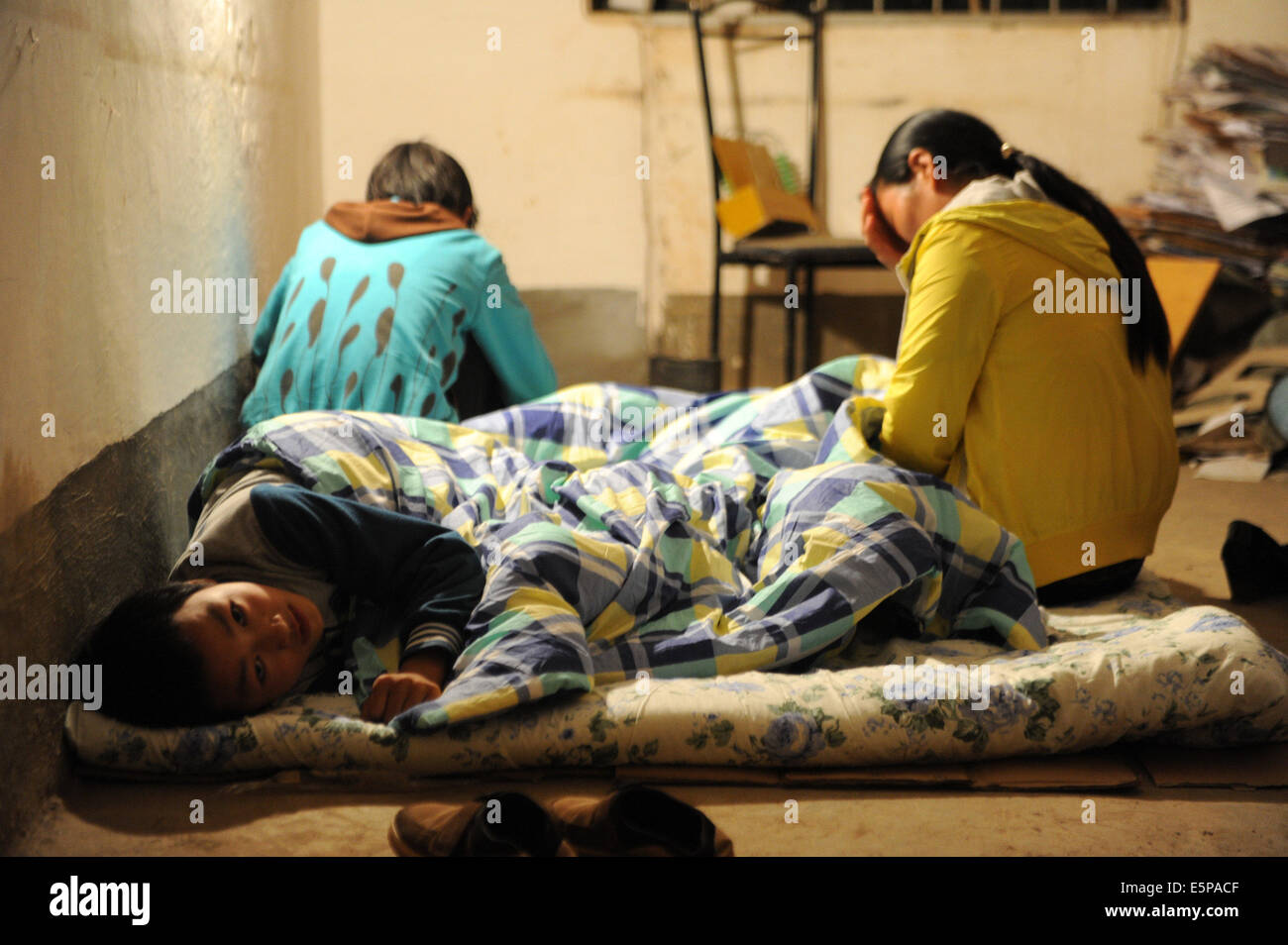 Weining, China's Guizhou Province. 4th Aug, 2014. Local residents rest ...