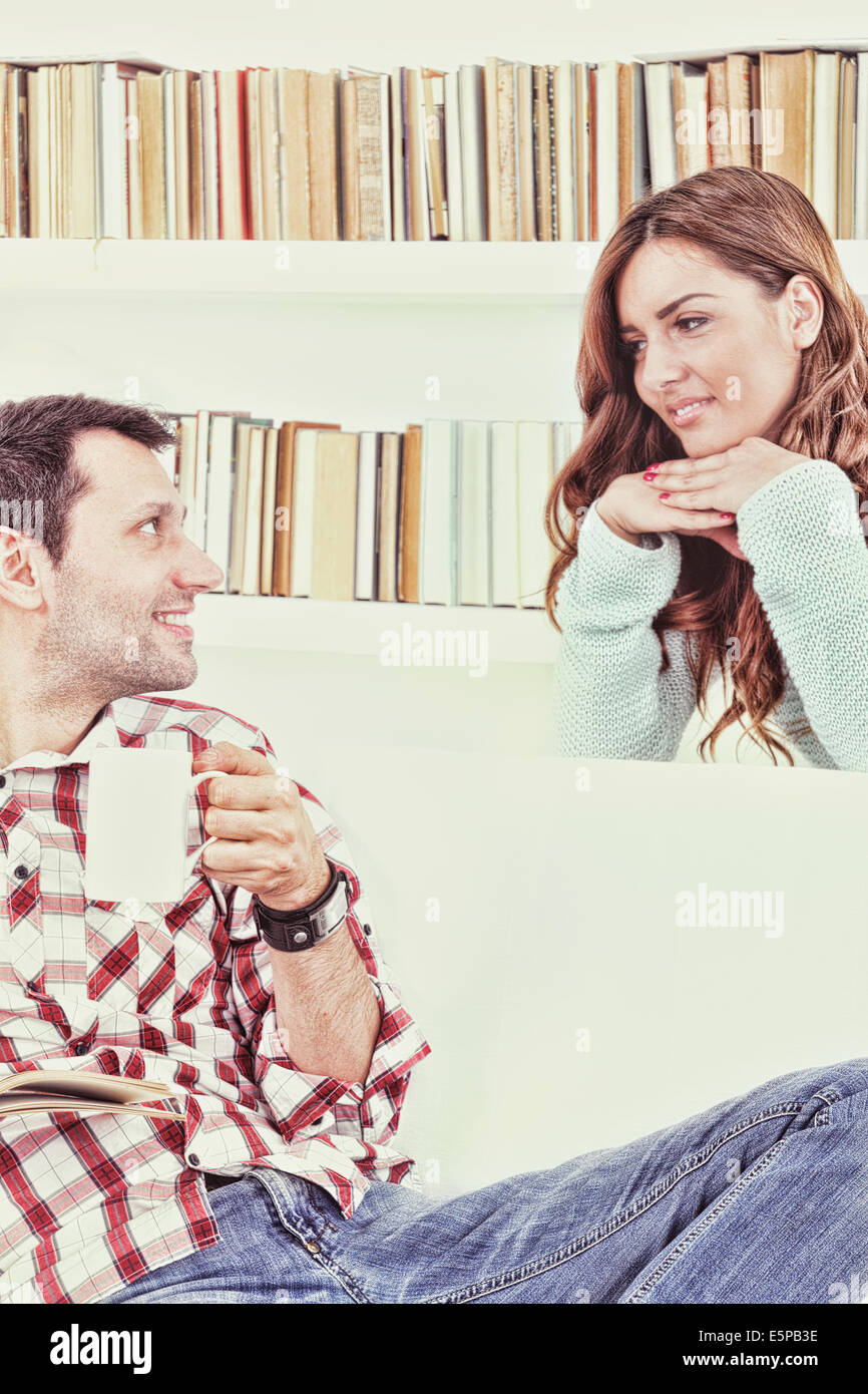 happy couple in love looking at each other, man with coffee talking and ...