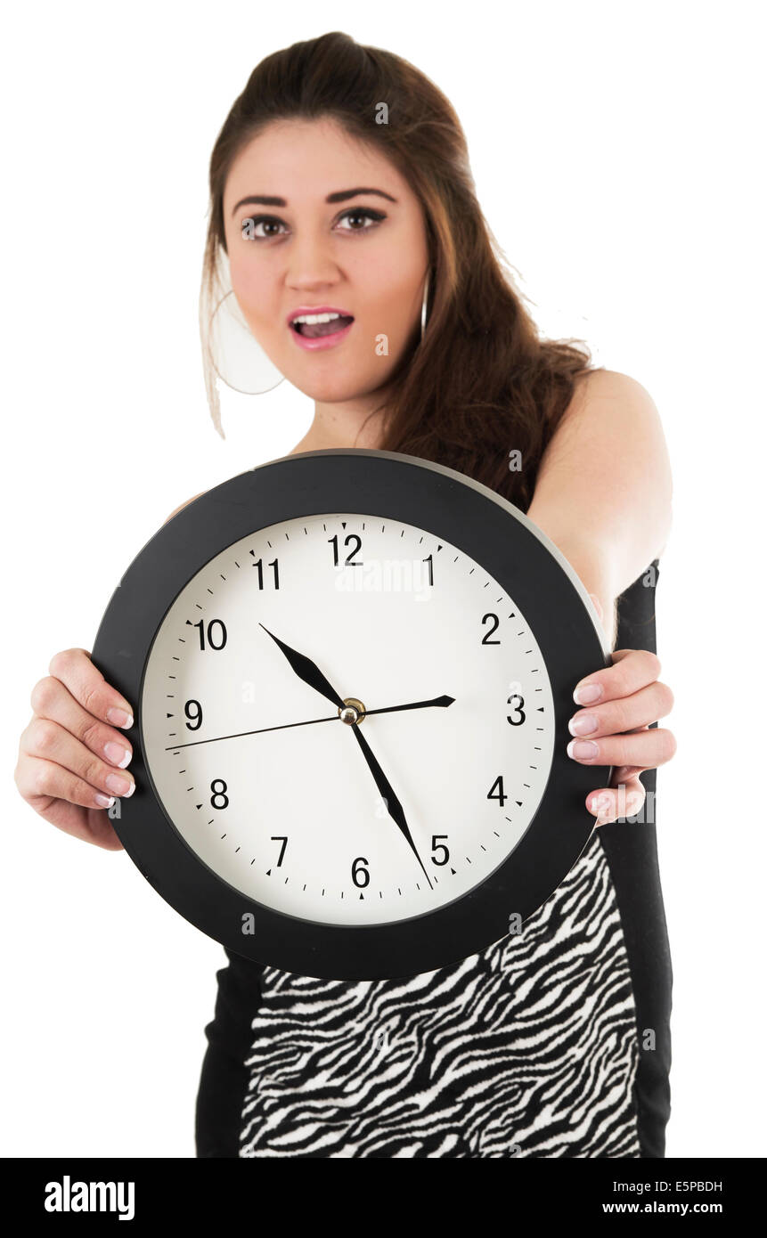 Pretty young hispanic girl holding black round clock Stock Photo - Alamy