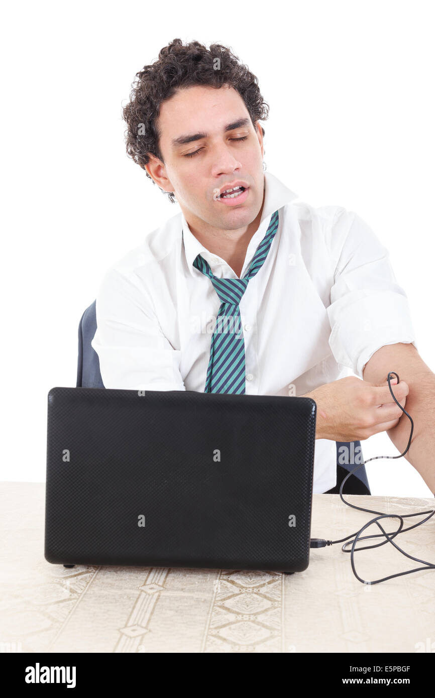 business man in suit addicted to internet put USB cable from laptop ...
