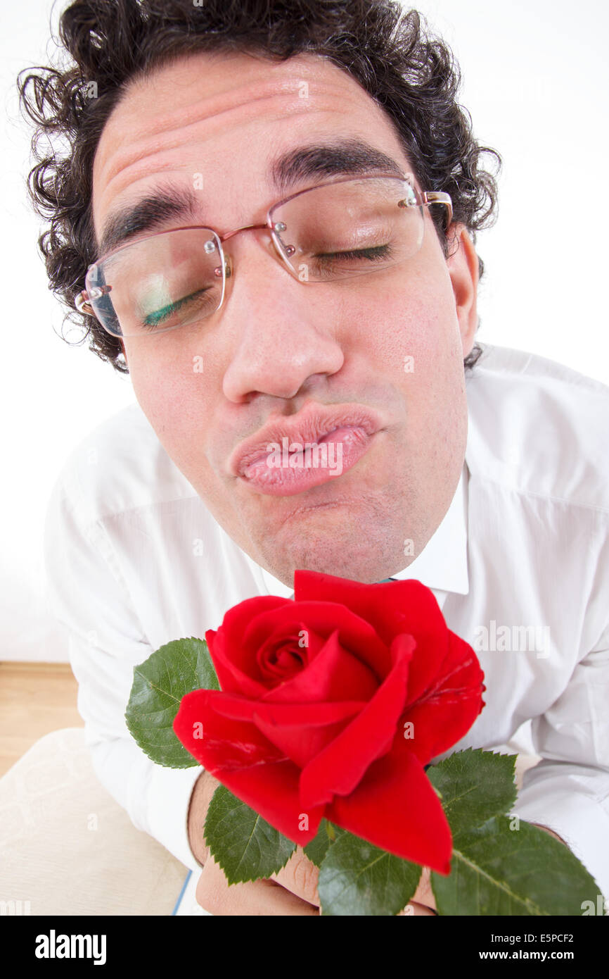 Romantic man with rose giving a kiss, Guy in love holding rose pouting ...