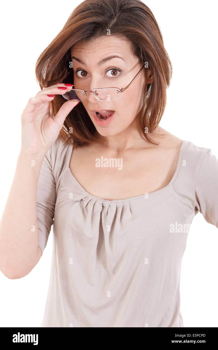 Surprised young woman holding eyeglasses and taking a closer look Stock ...