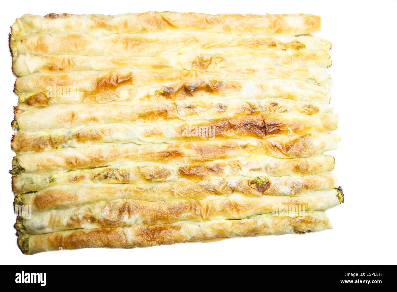 Homemade Serbian pie set in lines filled with cheese and spinach ...