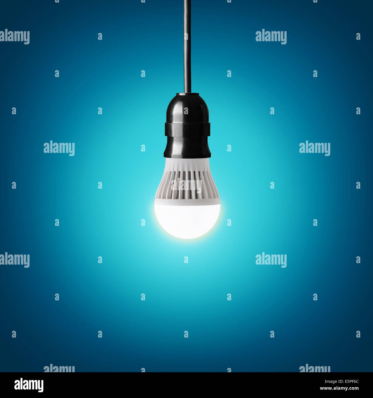 Bright light bulb blue background hi-res stock photography and images ...