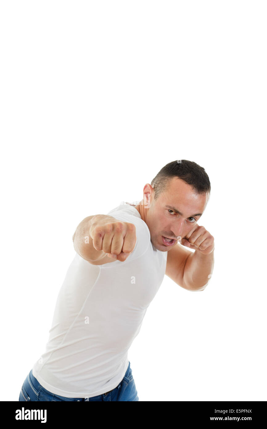 Aggressive adult man strikes blow with the clenched fist to camera ...