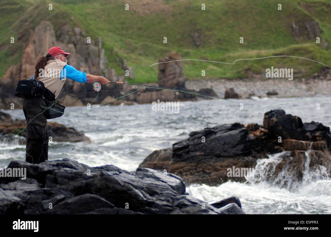 Salt water fly fisherman Dave Felce casting a fly fishing rod into the ...