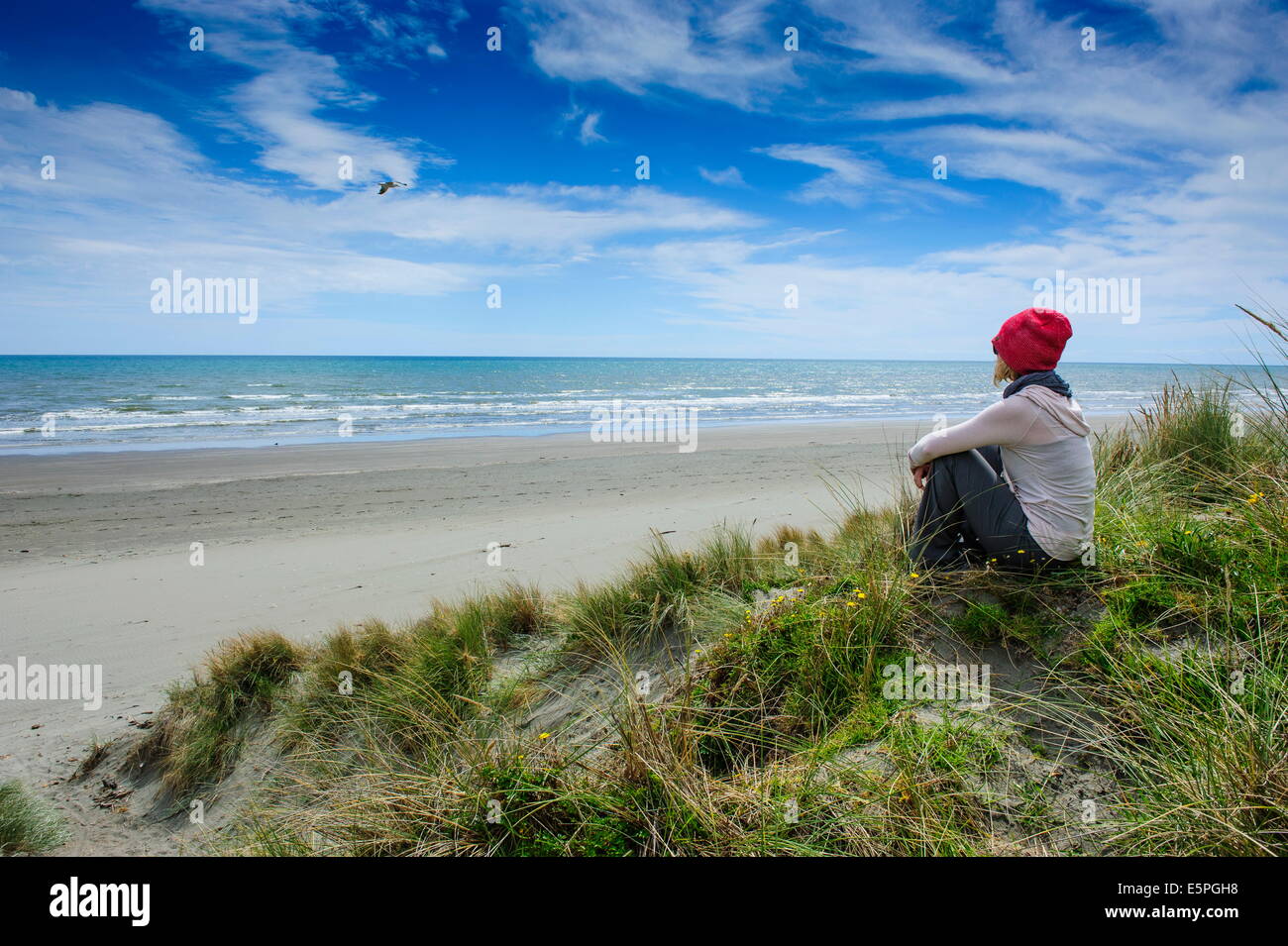Woman enjoying the view over Foxton beach, Kapiti Coast, North Island ...