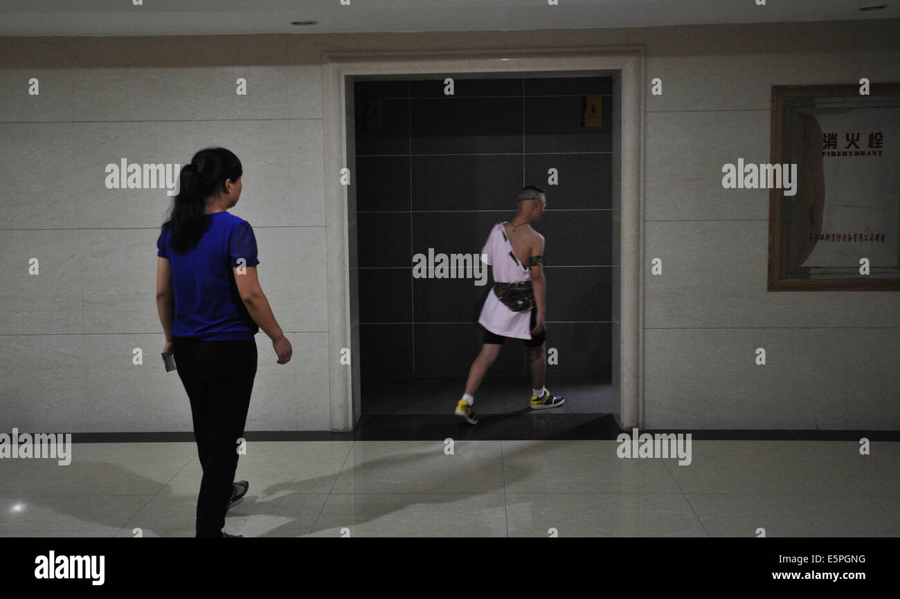 Changsha, China. 5th Aug, 2014. Liu Hongjun (R) goes to toilet before ...