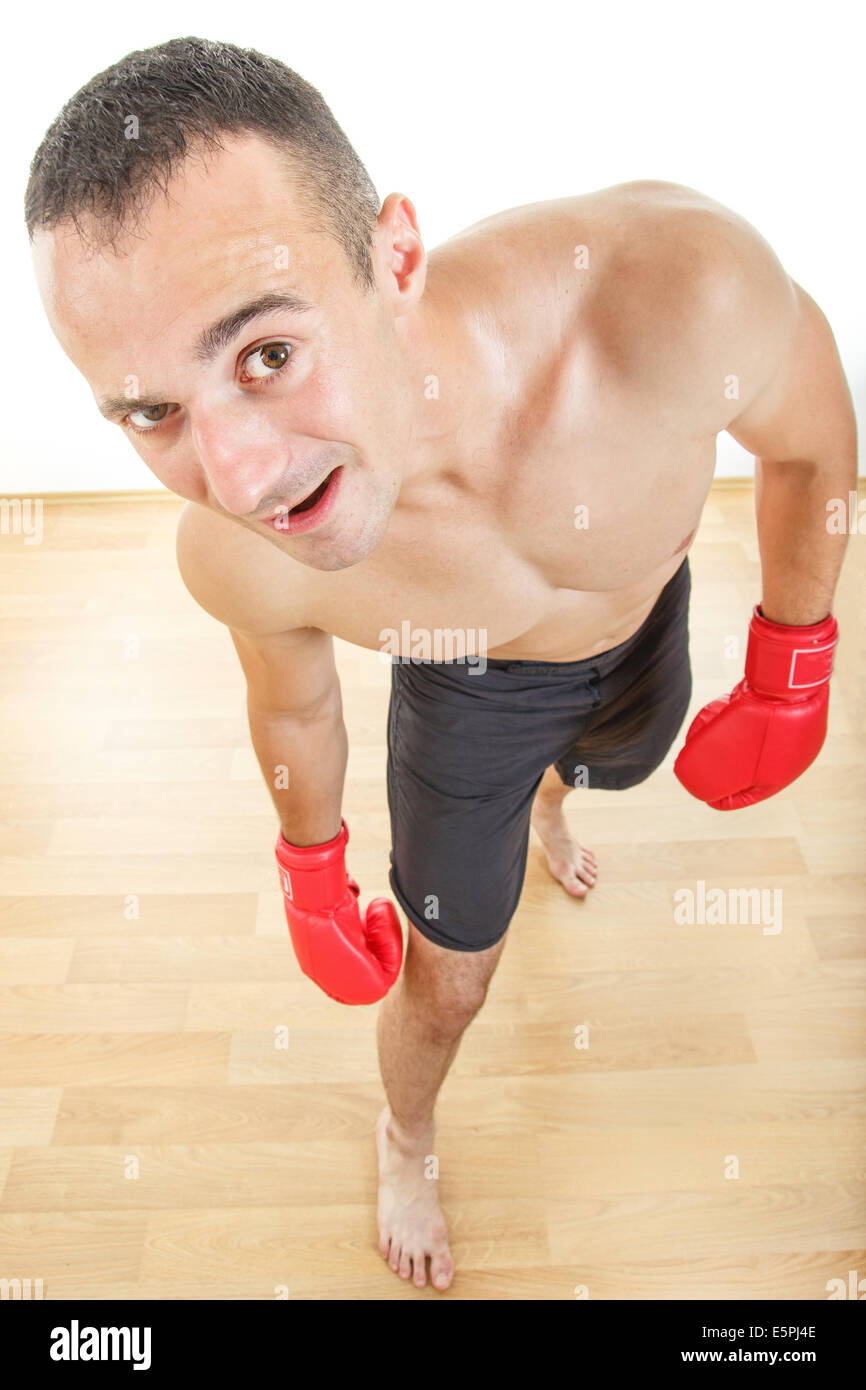 funny portrait of a confused and astonished man with boxing gloves ...