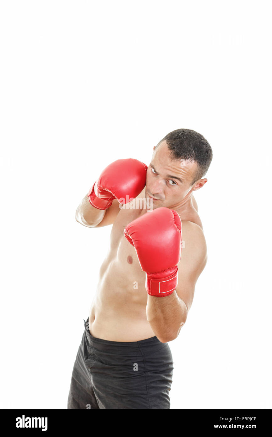 Handsome muscular male boxer ready to fight with boxing gloves in a ...