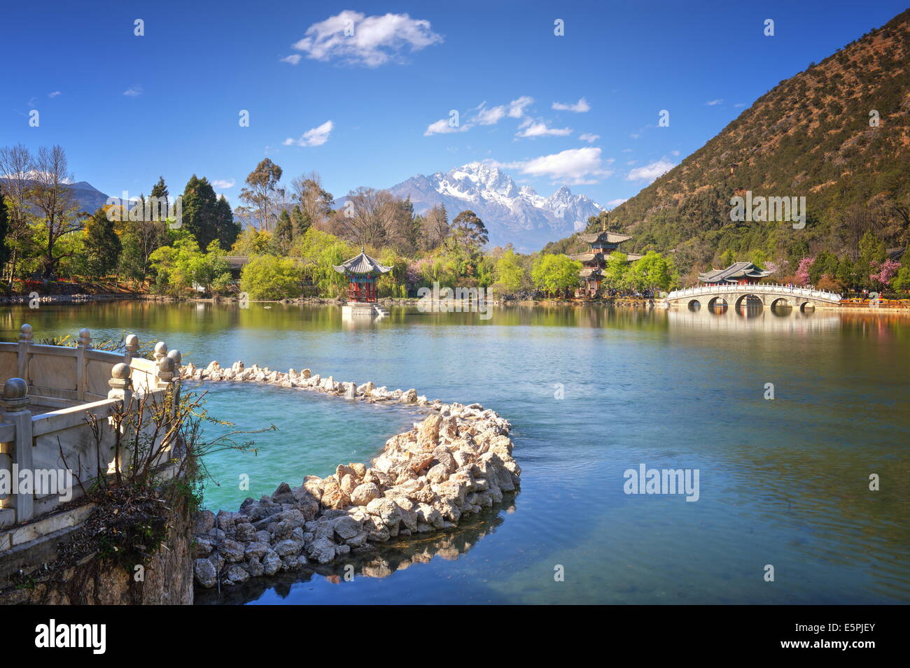 Heilongtan (Black Dragon Pool) with pool, pagodas, white marble bridge ...