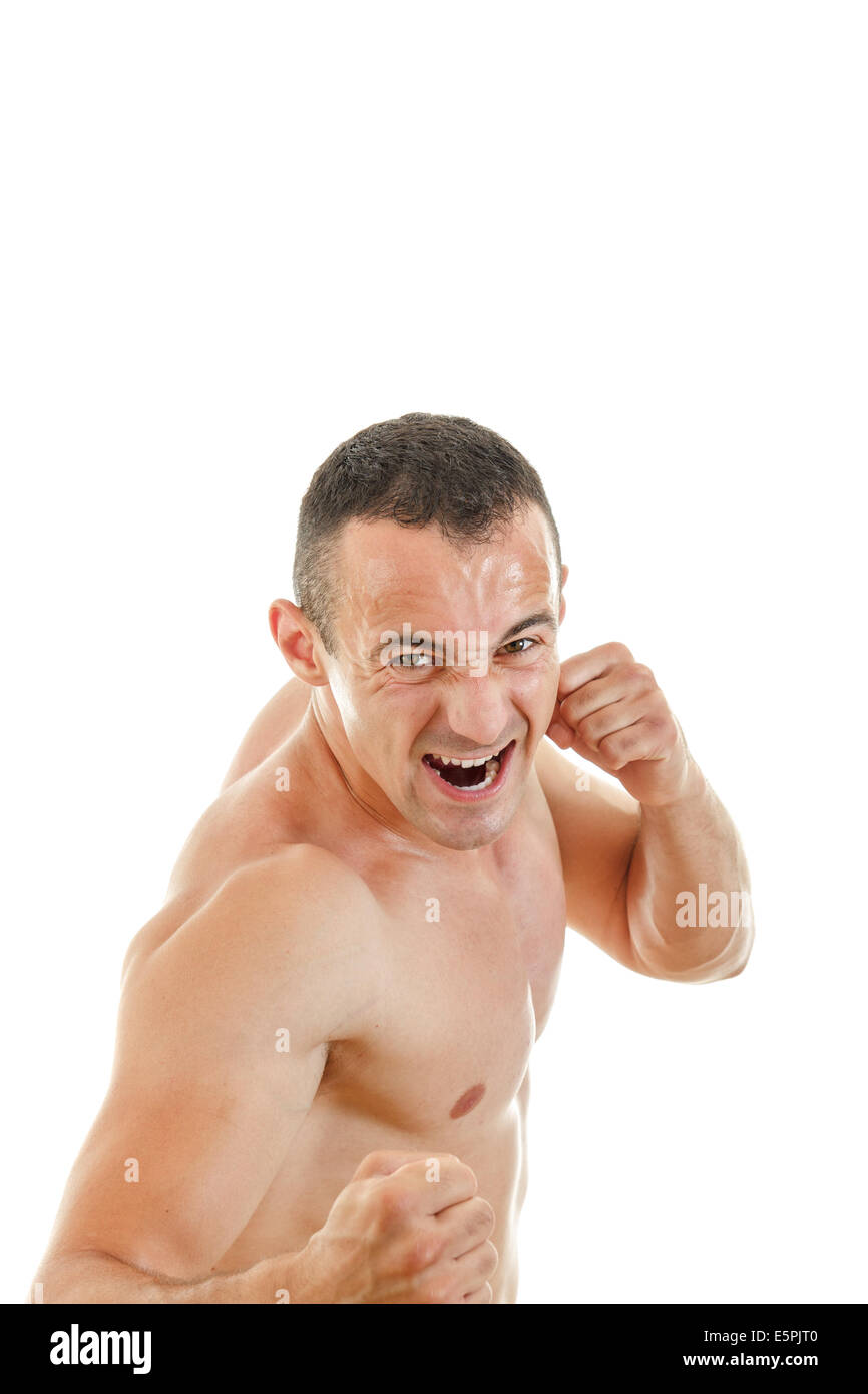 Muscular sportsman kick boxer fighting with excited and furious face ...