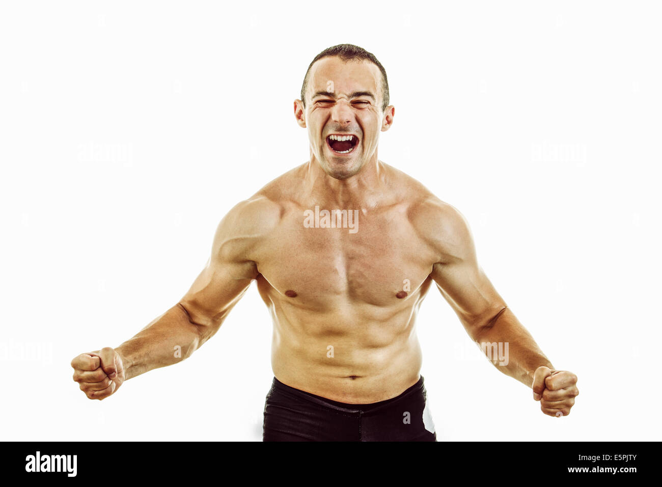 Strong muscular man bodybuilder ready to fight for victory by winning ...