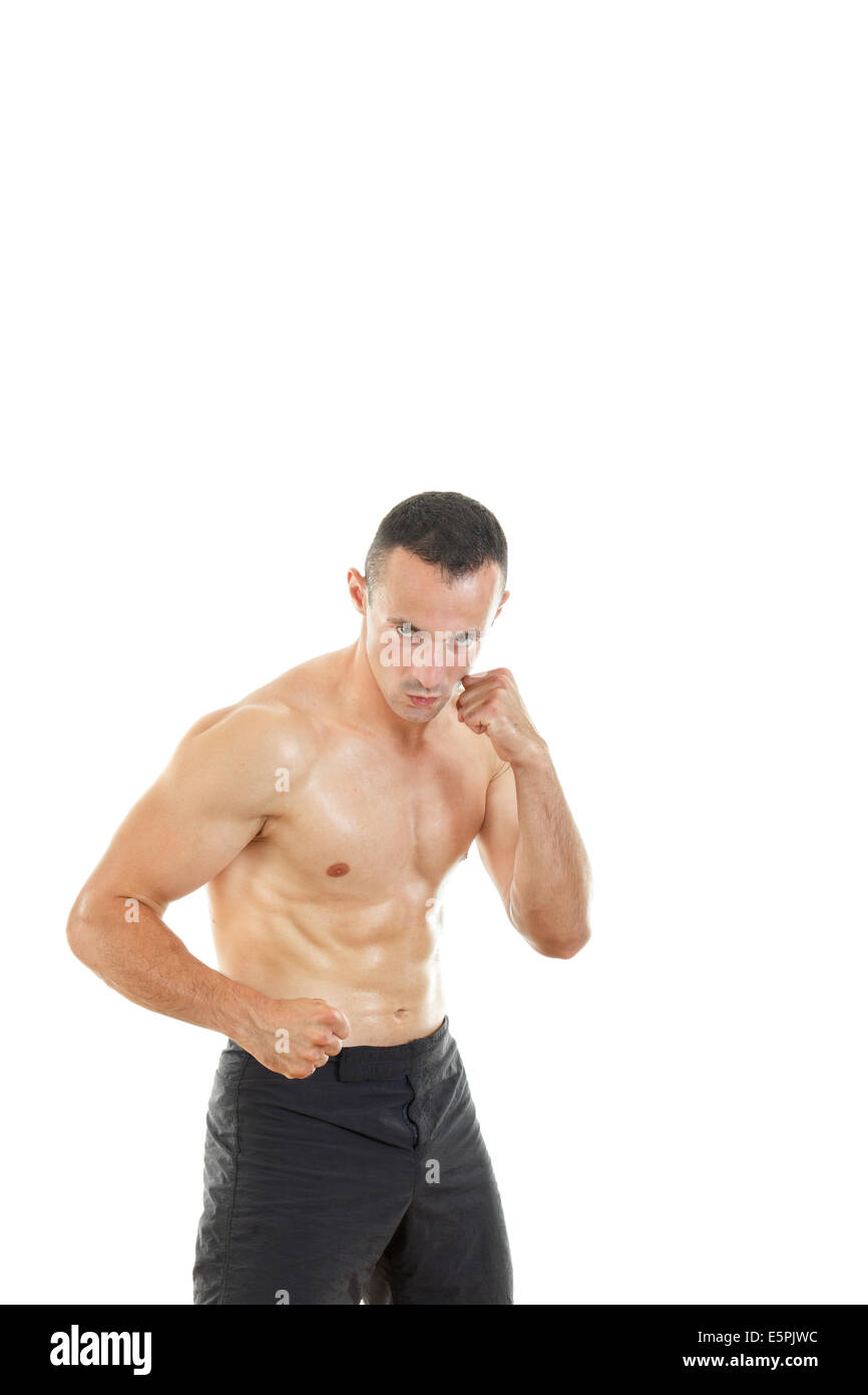 Young ultimate fighter with intense determination to win the fight ...