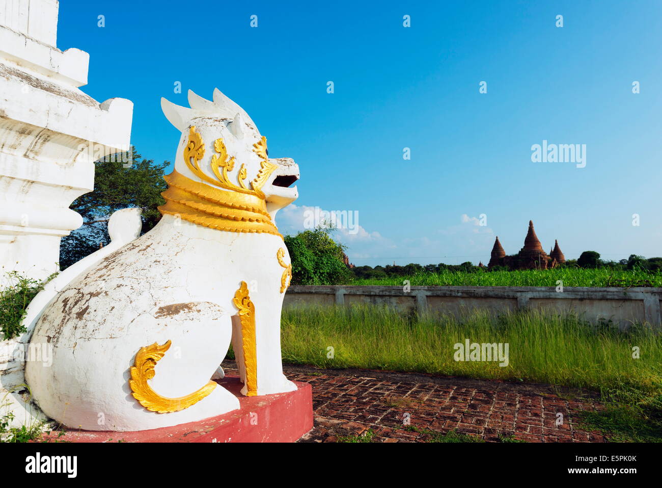 Lion statue and temple on Bagan plain, Bagan (Pagan), Myanmar (Burma ...