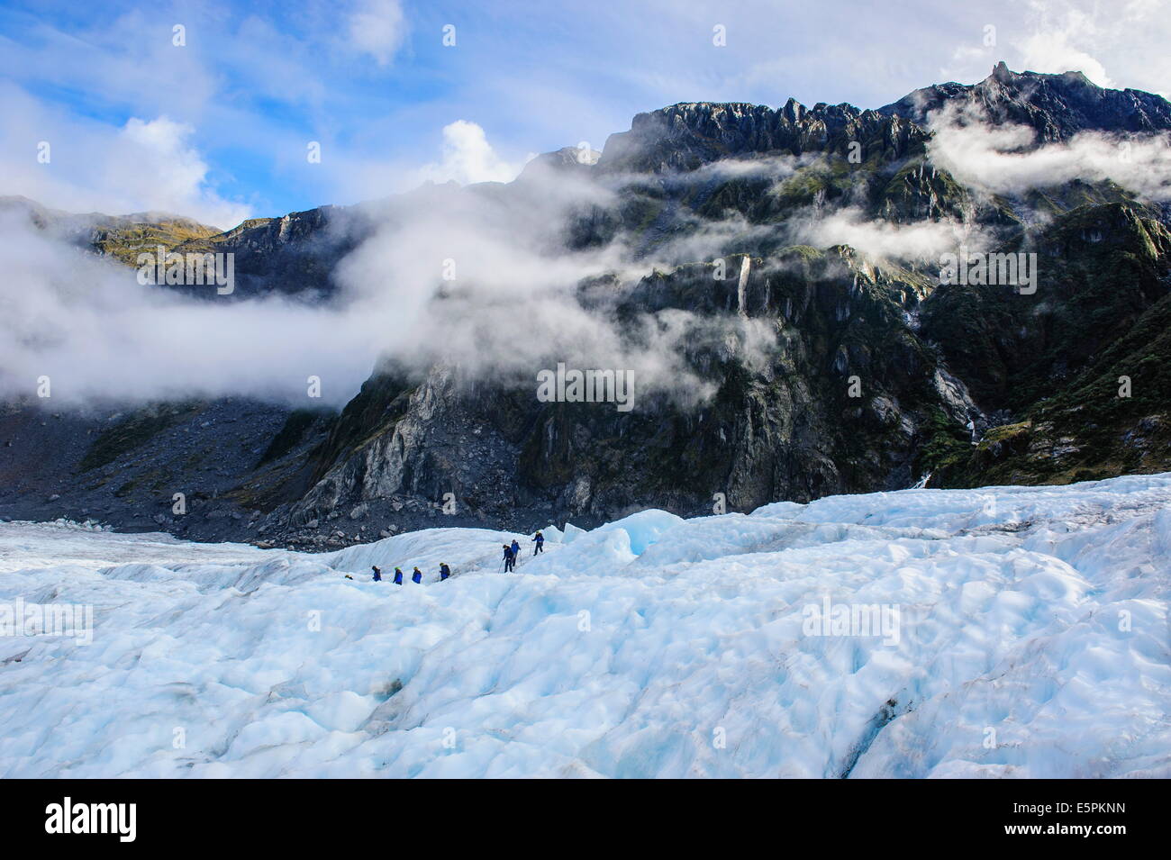 Tourist hiking on Fox Glacier, Westland Tai Poutini National Park ...