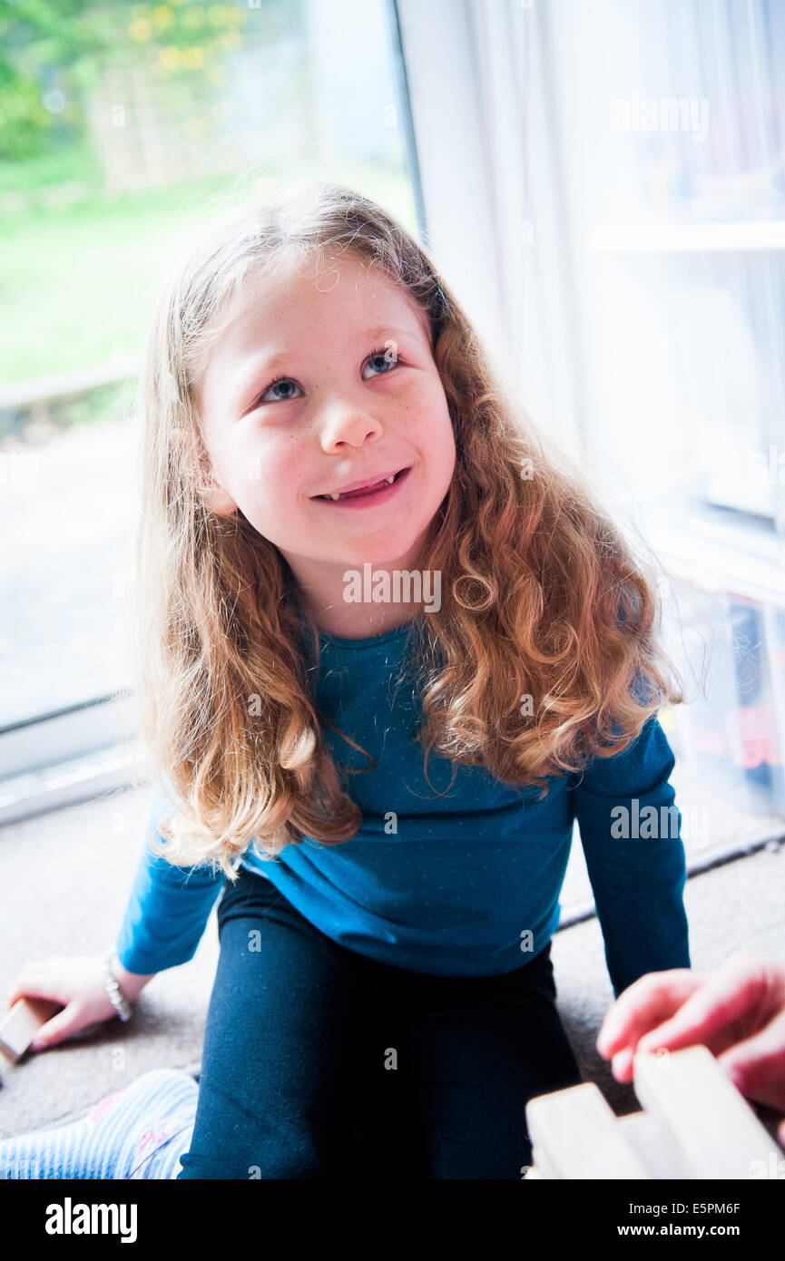 Girls 9 10 11 playing Jenga blocks game Stock Photo - Alamy