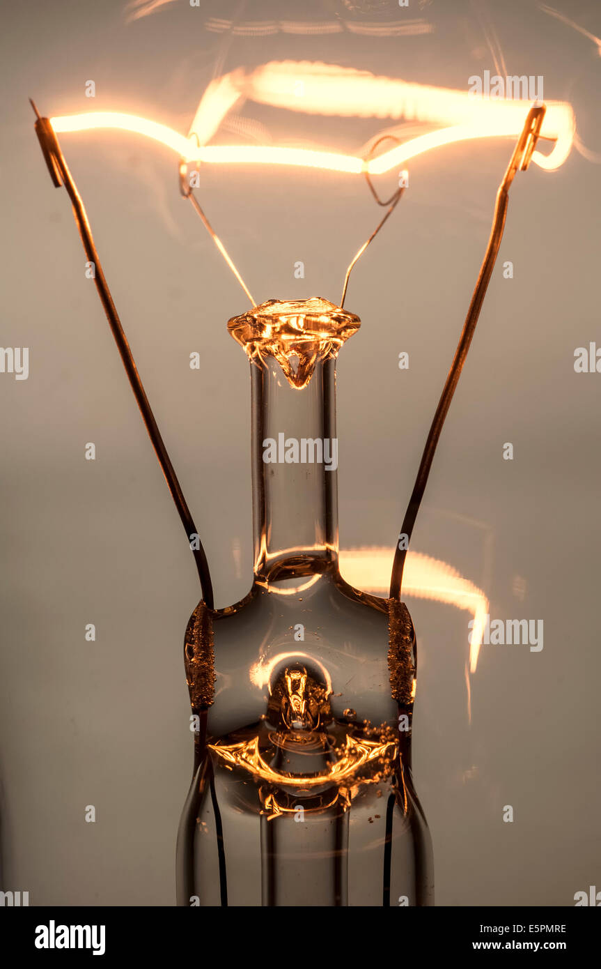 Close up glowing light bulb Stock Photo - Alamy