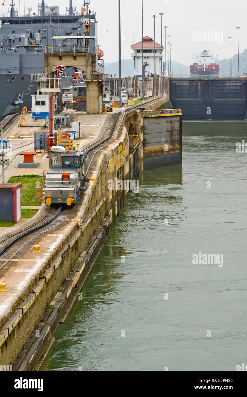Miraflores lock with ship approaching lock and large navy vessel at ...
