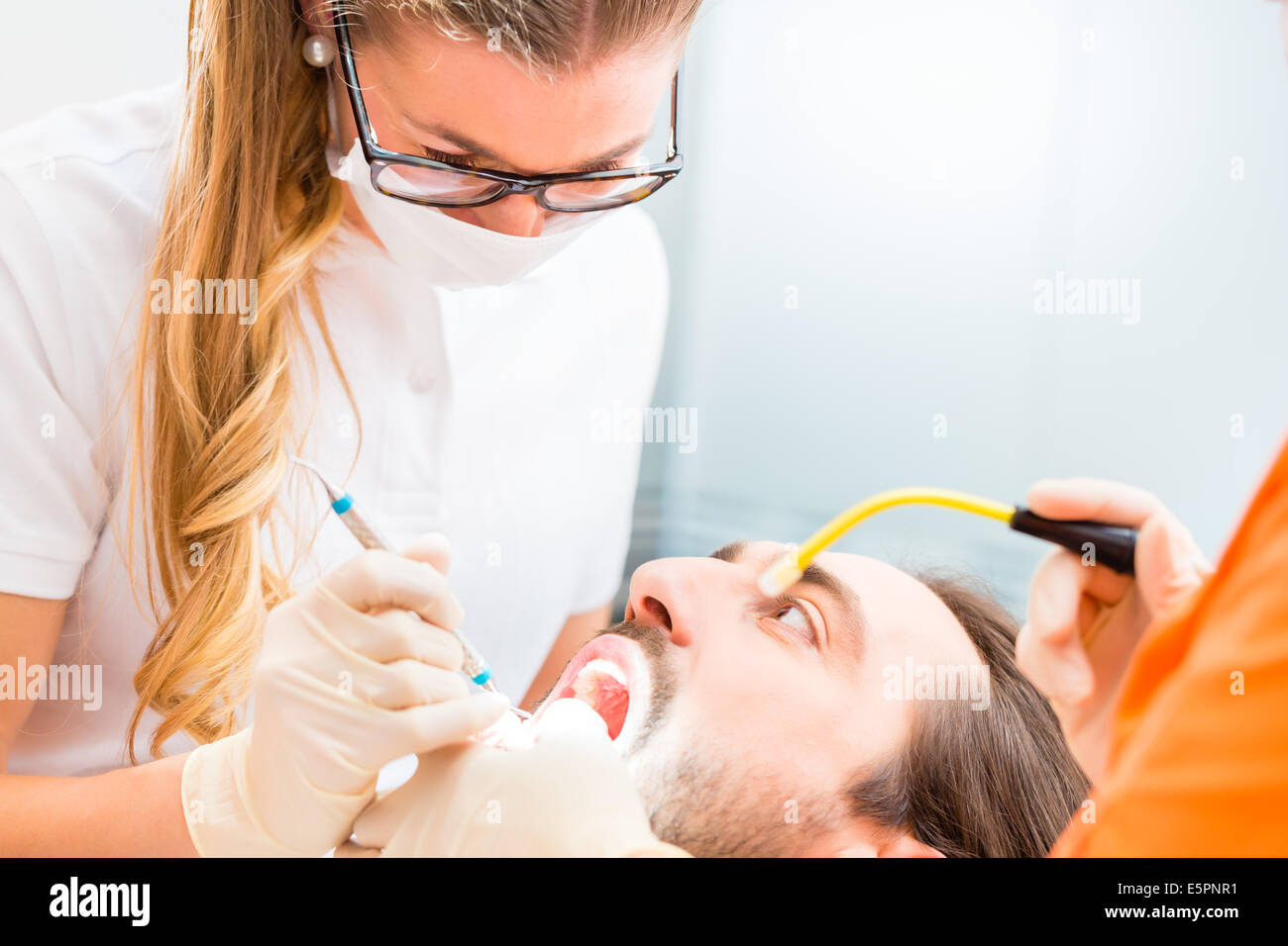 Nurse cleaning teeth hi-res stock photography and images - Alamy