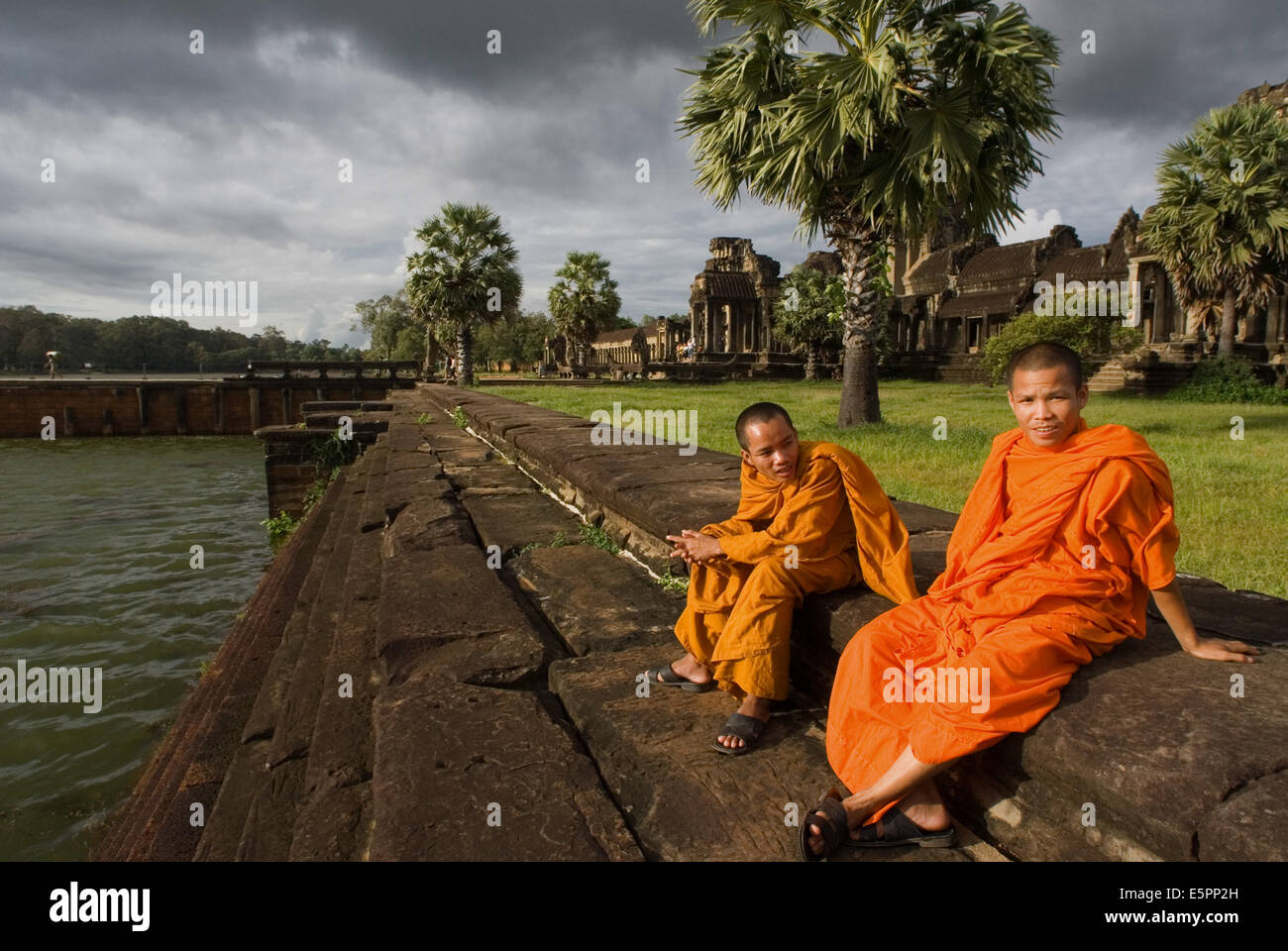 Two Buddhist monks on the outside of the Temple of Angkor Wat. Angkor ...